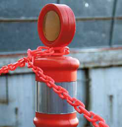 Brightly colored plastic safety chain are often used with guide posts ...